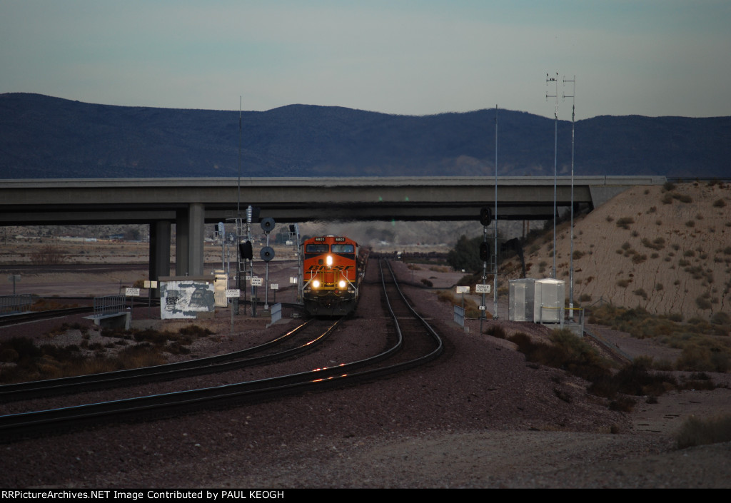 BNSF 6801 Leads a Bare Table Train west towards LA.
